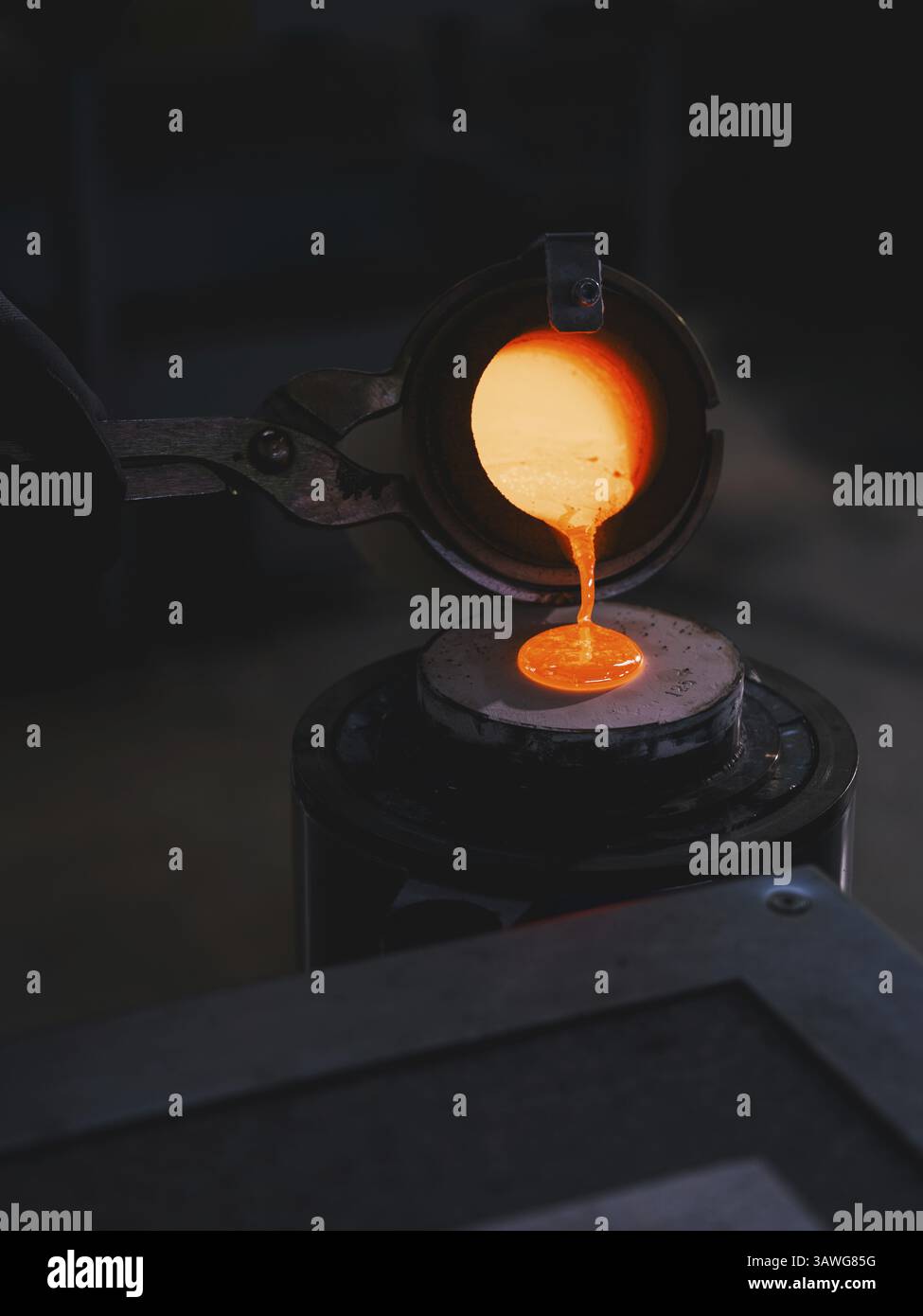 Hot metal casting process in an industrial environment with a flowing ...