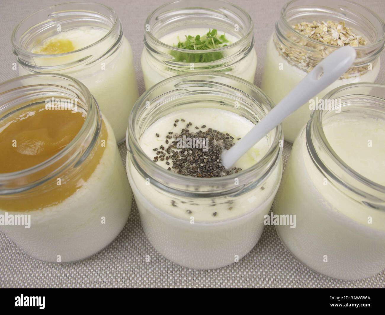 Yoghurt in a jar from the yoghurt maker with topping Stock Photo - Alamy