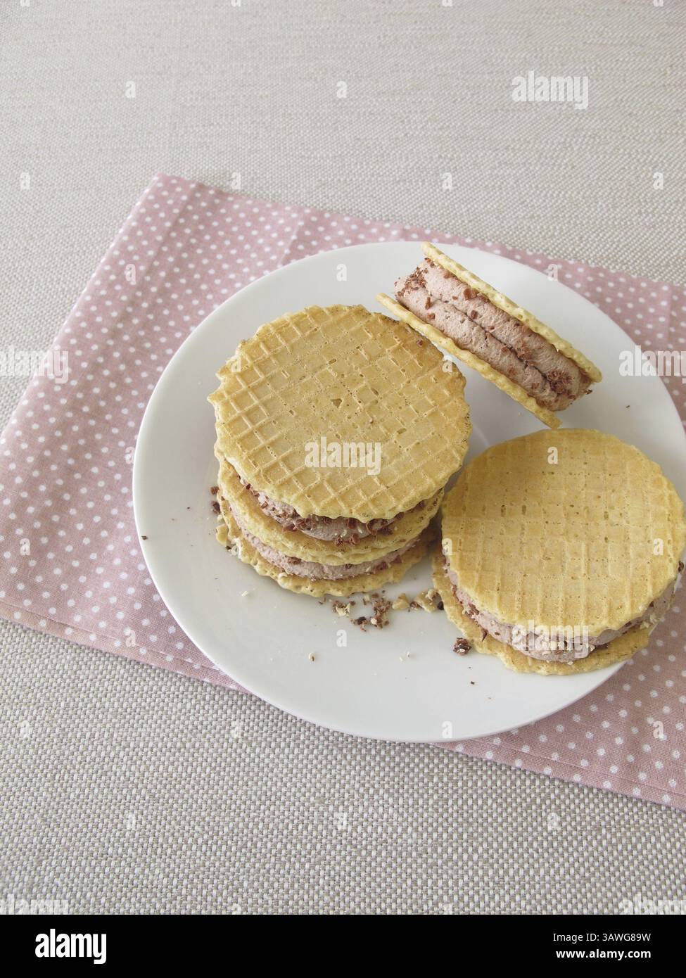 Round waffles with chocolate ice cream filling Stock Photo - Alamy