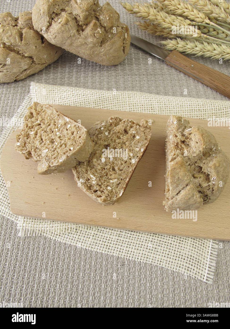 Sliced wholemeal bread rolls Stock Photo - Alamy
