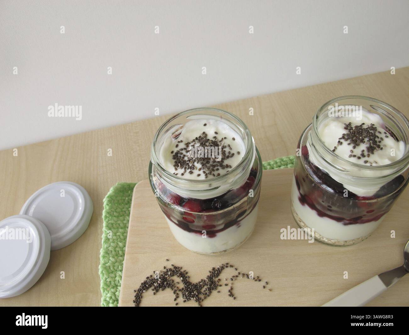 Berry yoghurt with chia topping Stock Photo - Alamy