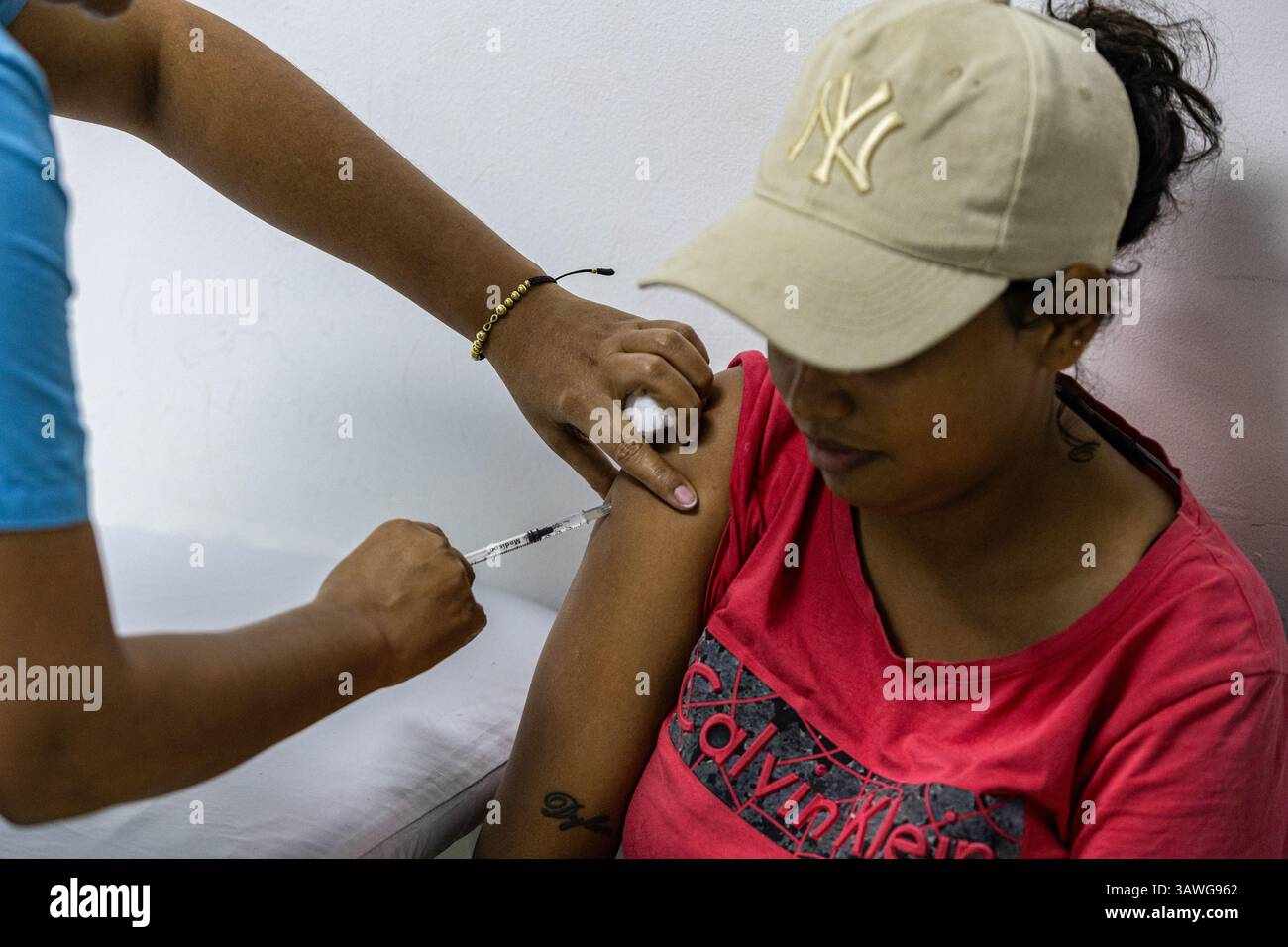A woman gets a dose of yellow fever. Colombia's Government has declared ...