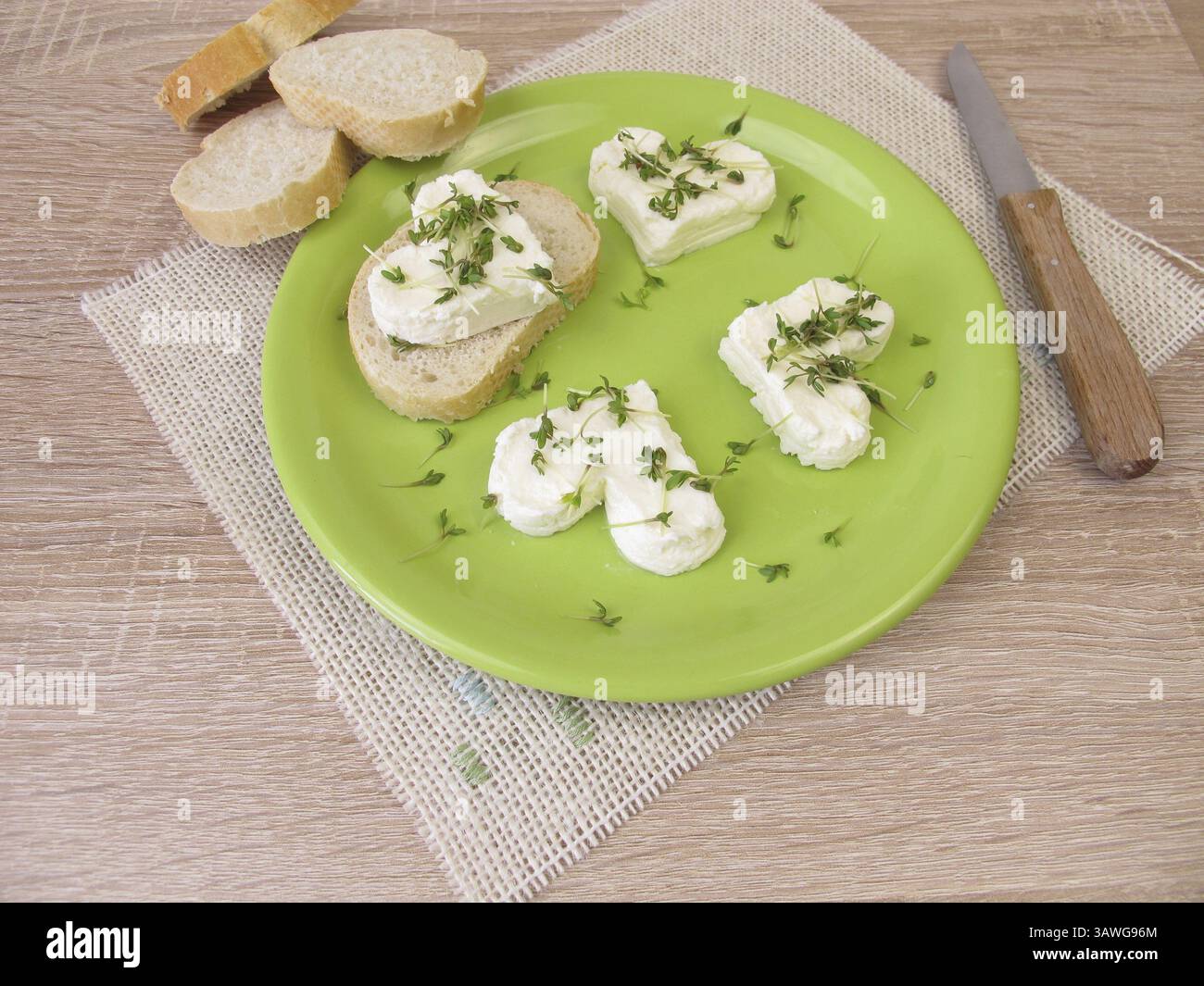 Cream cheese hearts with cress sprouts Stock Photo - Alamy