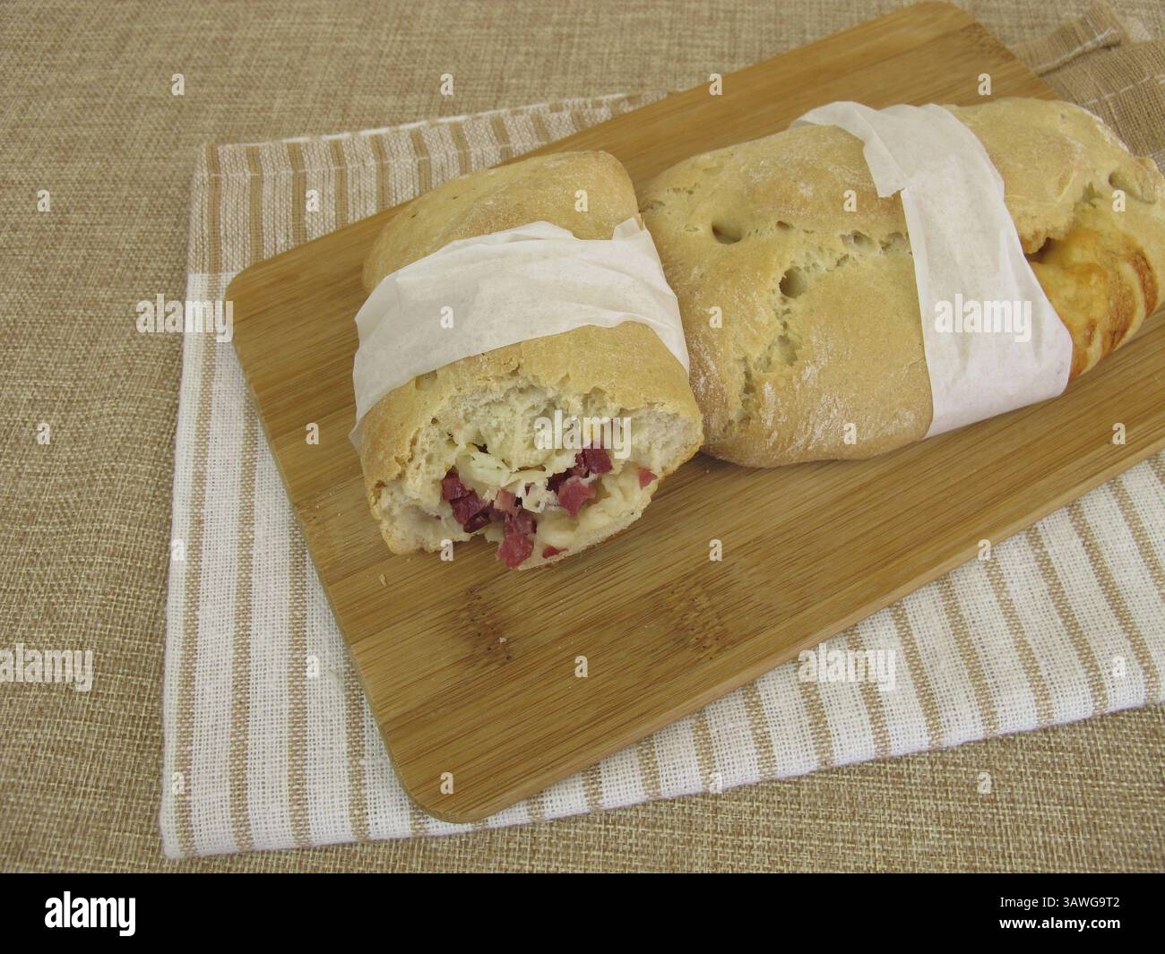 Hand bread street food with ham cubes and cheese Stock Photo - Alamy