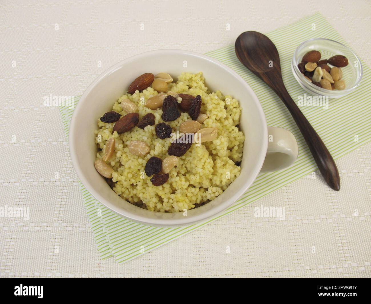 Millet with nuts and sultanas Stock Photo - Alamy