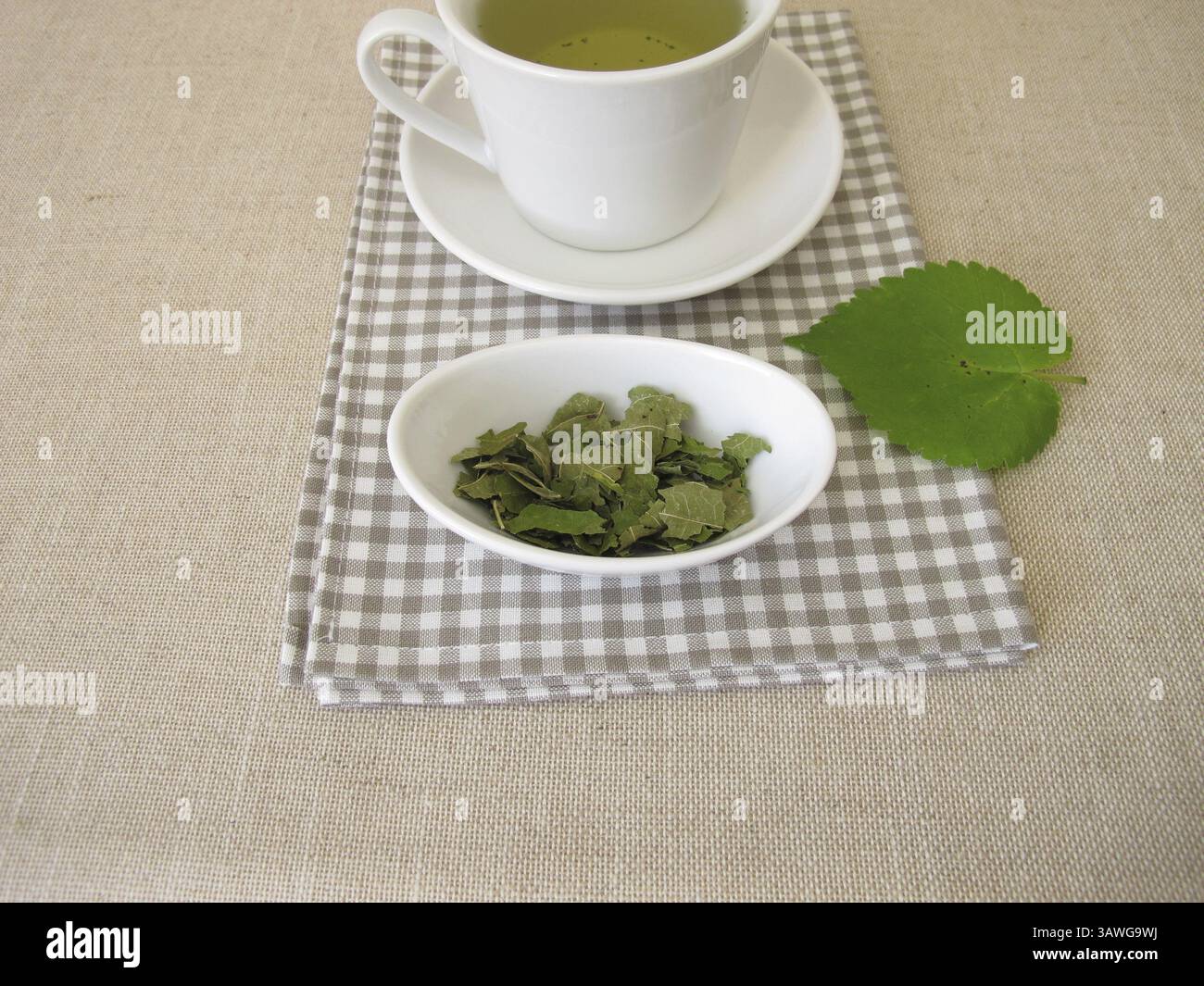 Mulberry leaf tea made from dried white mulberry leaves Stock Photo - Alamy
