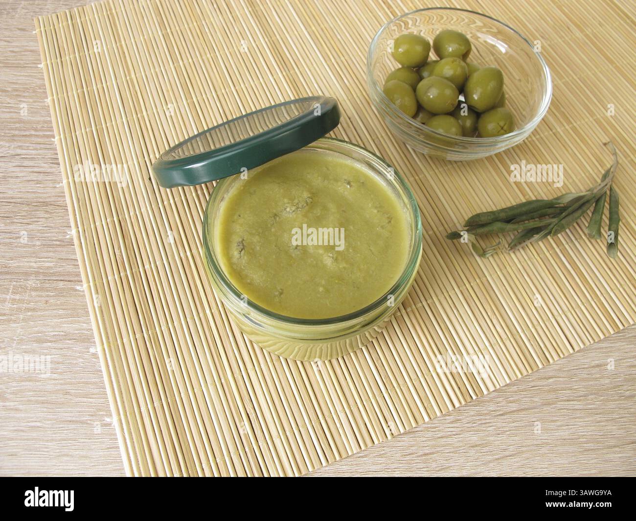 Green olive jam in a jar Stock Photo - Alamy