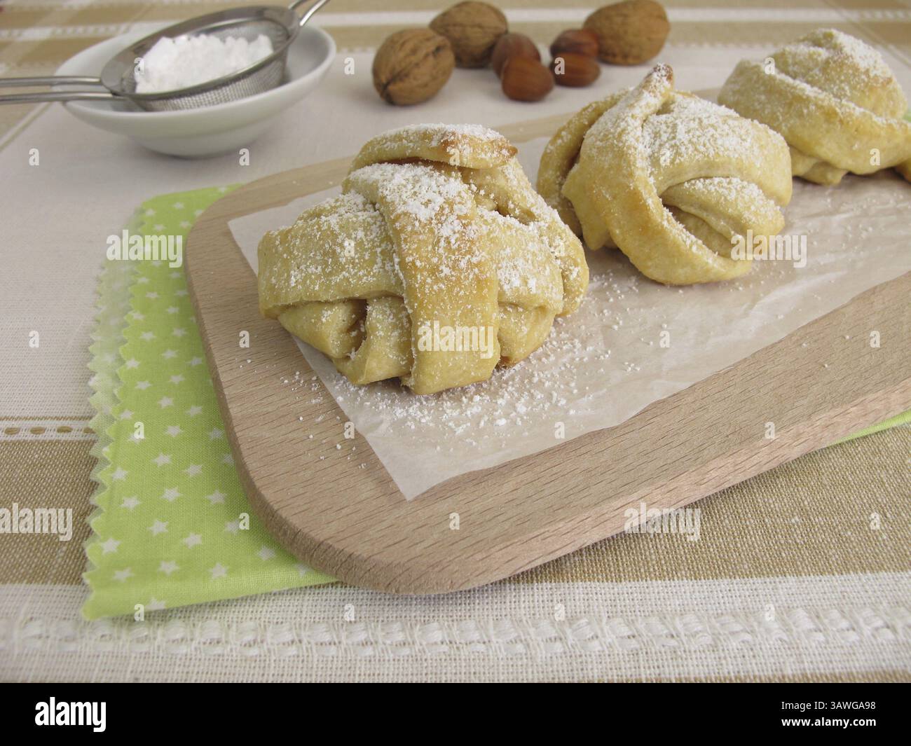 Baked snowballs made from shortcrust pastry with icing sugar Stock ...