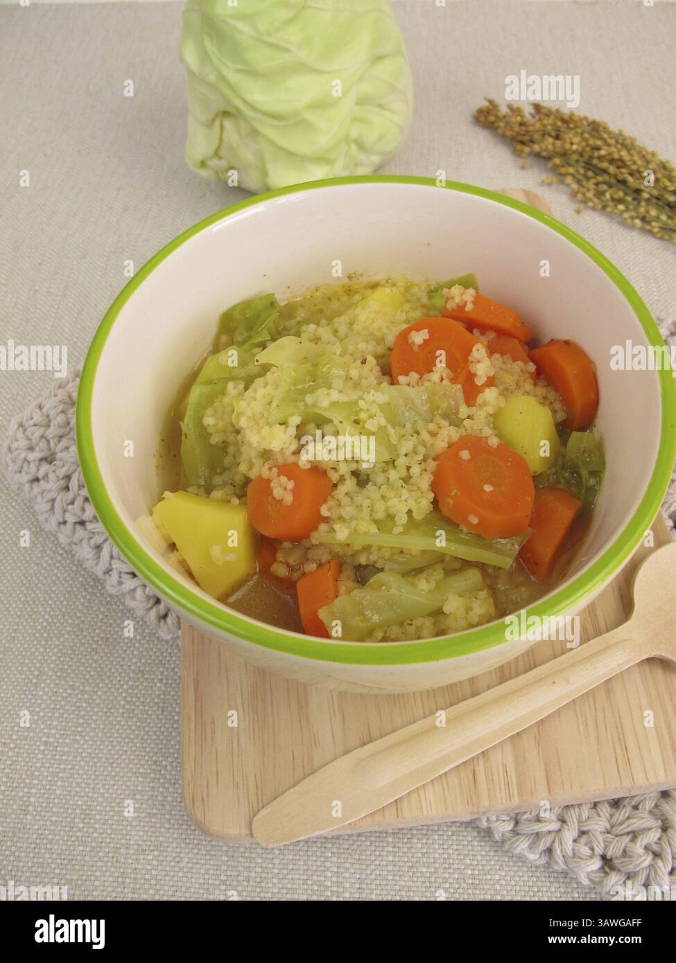 Stew with pointed cabbage and millet Stock Photo - Alamy