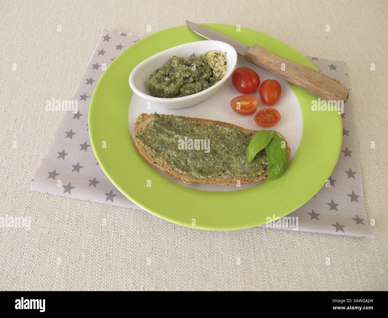 Homemade vegan hemp paste with basil on a slice of bread Stock Photo ...