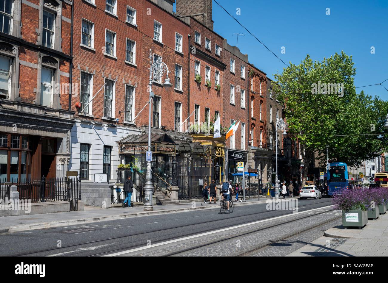 DUBLIN, IRELAND – AUGUST 10, 2023: Street scene in Dublin with red ...