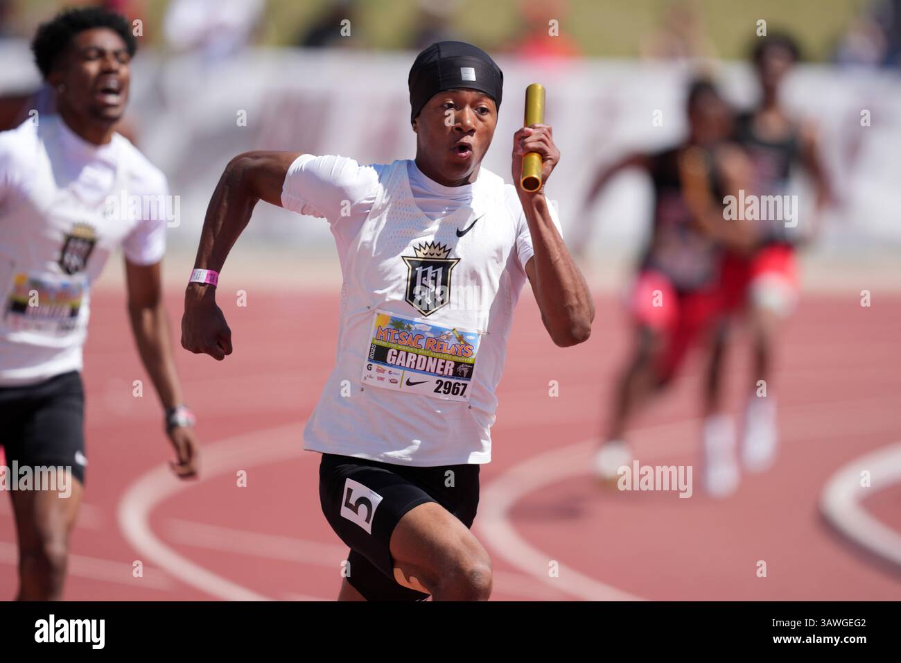 Robert Gardner (2967) runs the anchor leg on the Servite 4 x 100m relay ...
