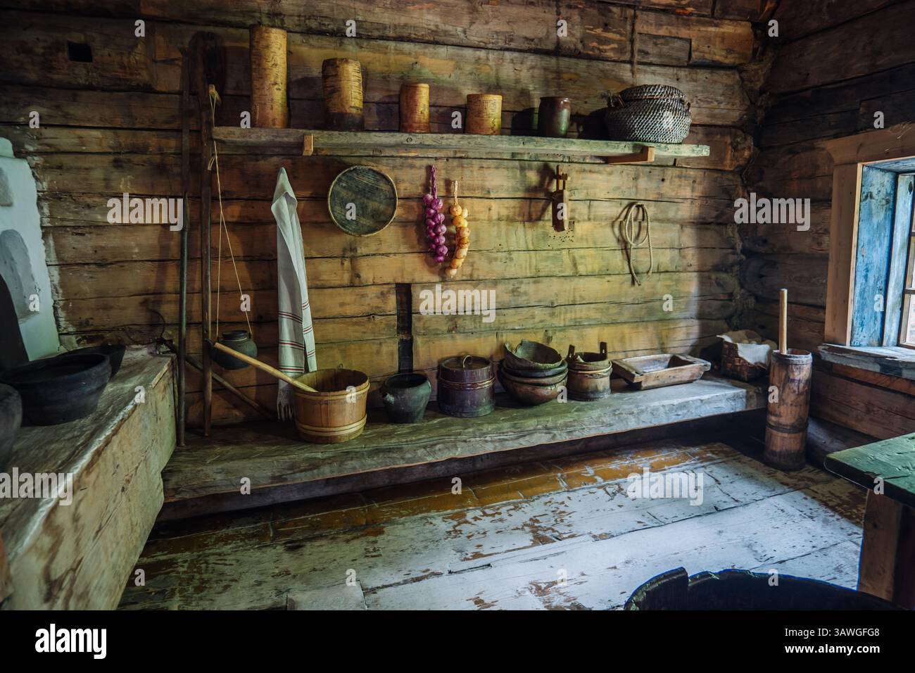 Ancient wooden kitchen in a rural house in russia, displaying ...