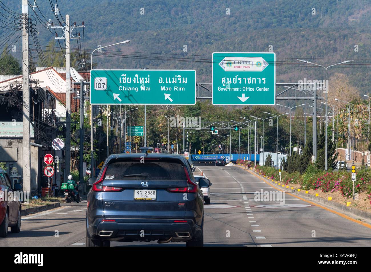 Overhead traffic gantry showing direction to the cities of Chiang Mai ...