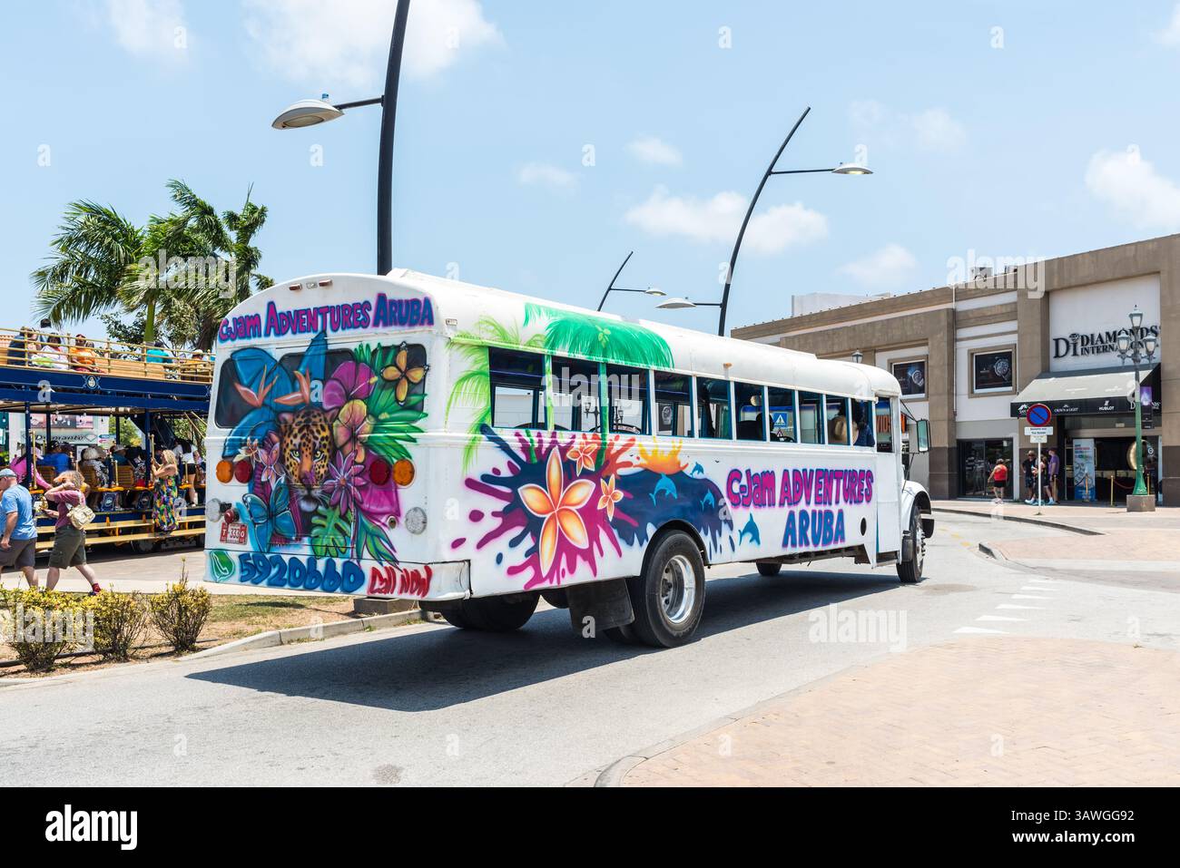 Oranjestad, Aruba - April 11, 2024: Colourful tourist bus awaits cruise ...
