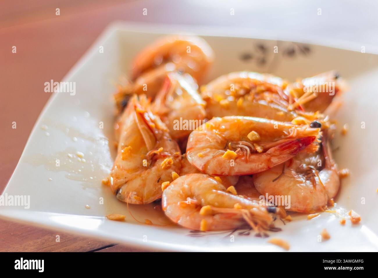 A serving of garlic shrimp on a plate during lunch in Kalibo ...