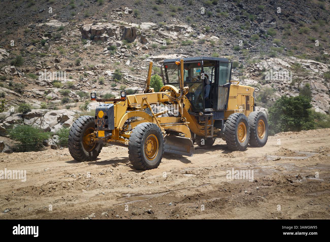 Construction machine motor grader during road works in Rajasthan. India ...
