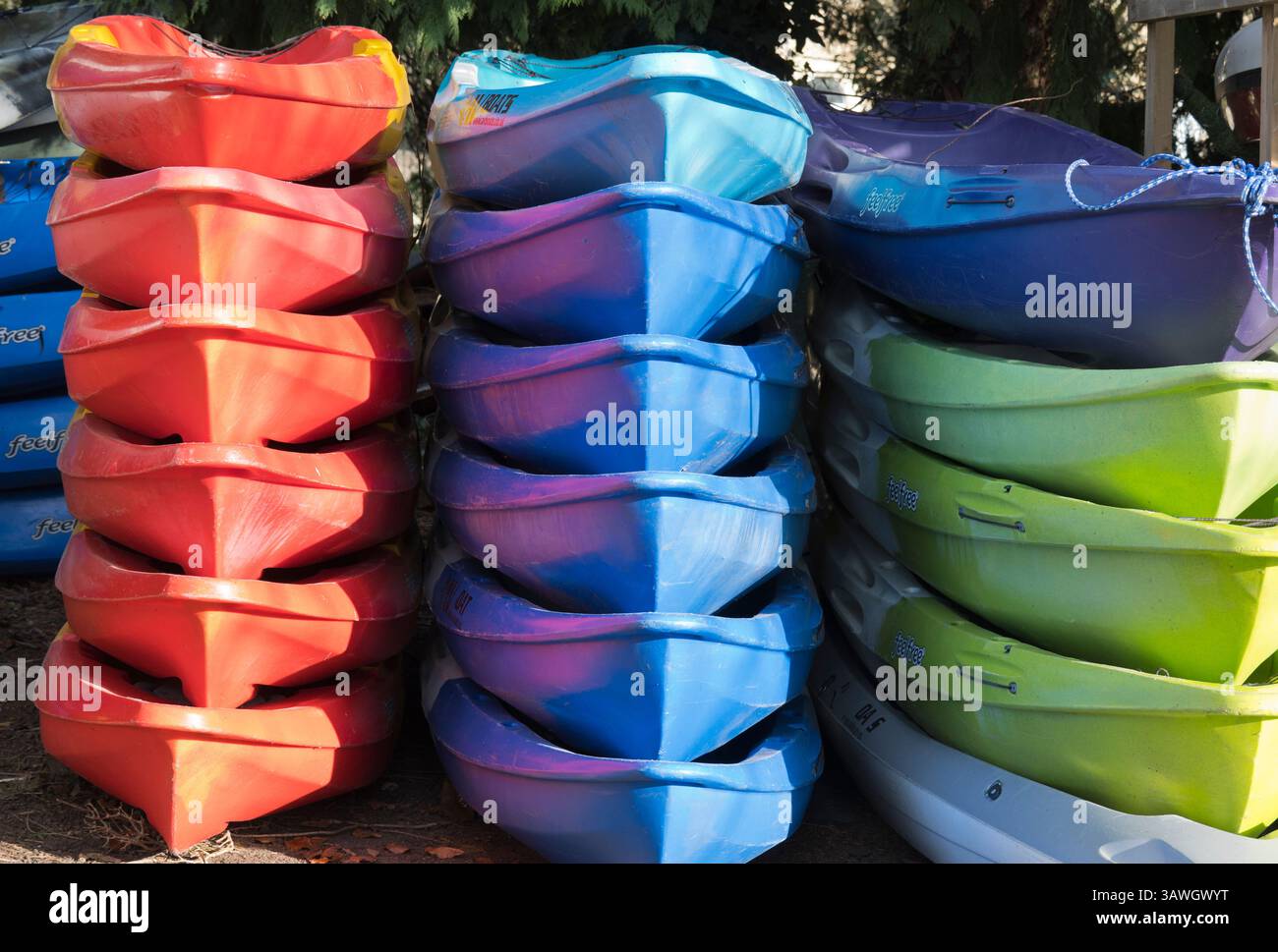 Brightly coloured canoes stacked on the boathouse of Nag's Head Island ...