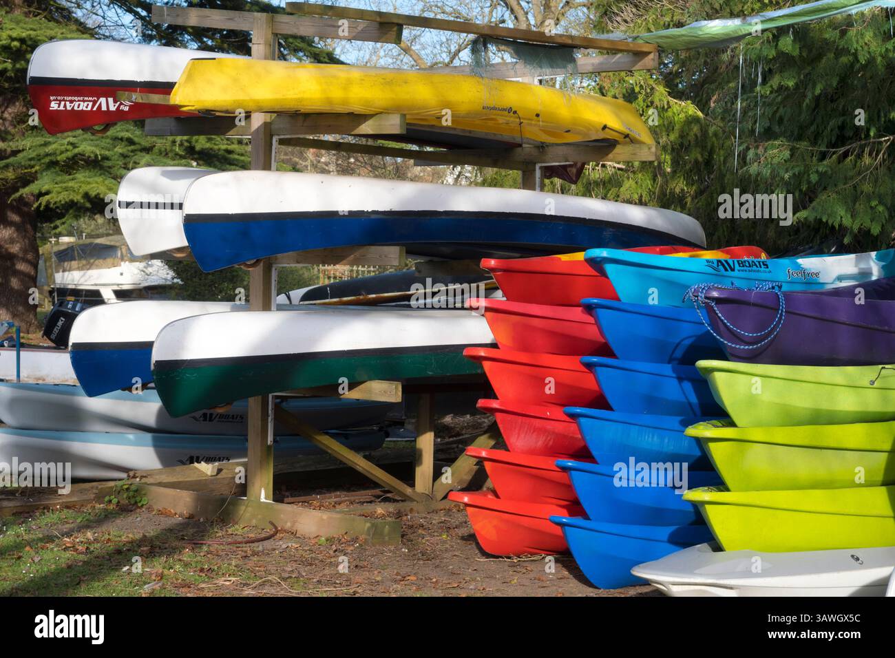 Brightly coloured canoes stacked on the boathouse of Nag's Head Island ...