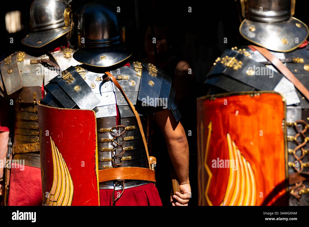 close up of roman legionary with scutum shield, armour and helmet in ...