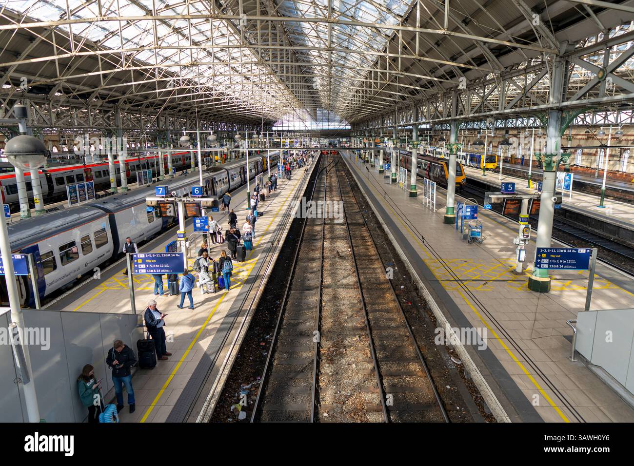 Manchester Piccadilly Train station platforms with passengers waiting ...