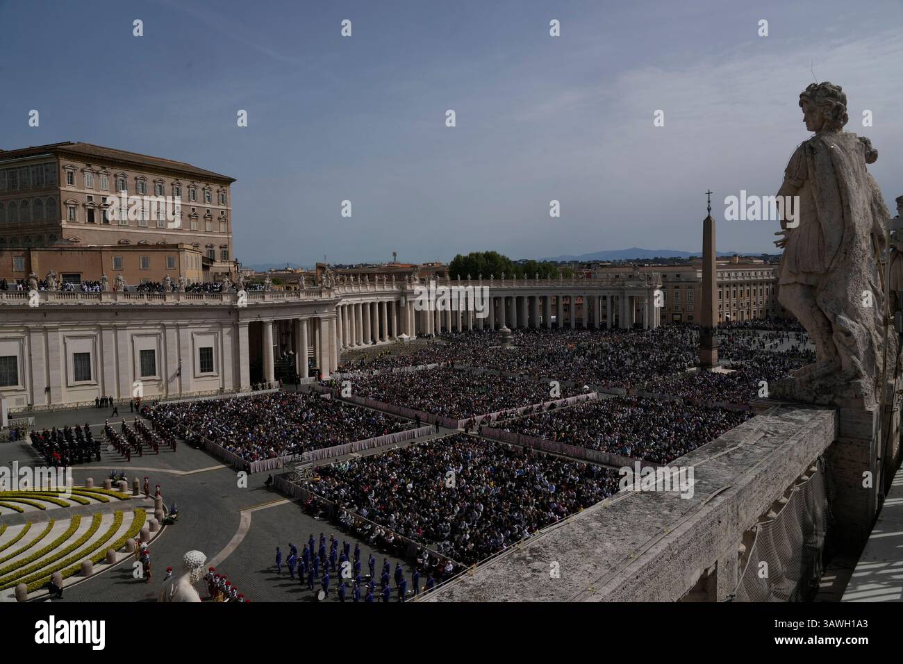 Faithful attend the Easter mass presided over by Cardinal Angelo ...