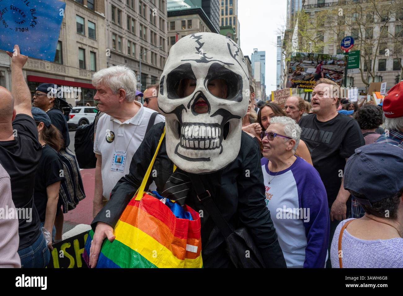 A protester wears a skull costume during the demonstration. Organizers ...