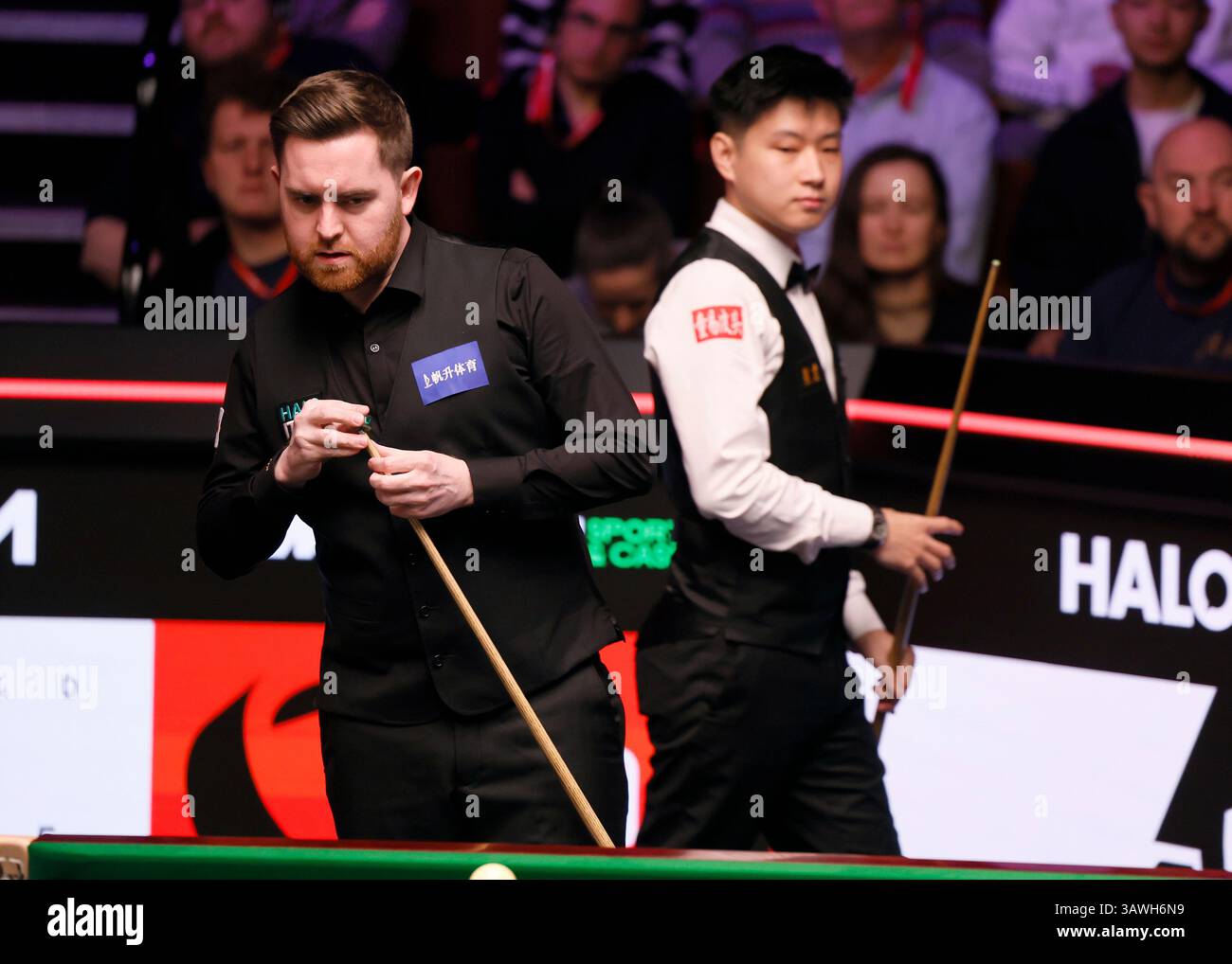 Jak Jones (left) during his match against Zhao Xintong during day two ...