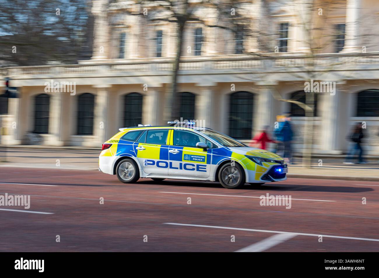 Police car with blue lights on emergency call travelling at speed on ...