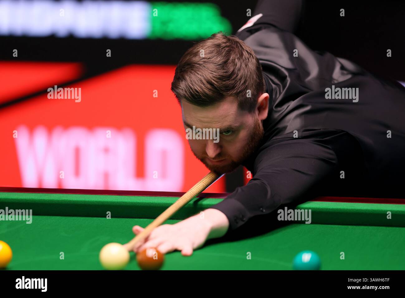 Jak Jones during his match against Zhao Xintong (not pictured) during ...