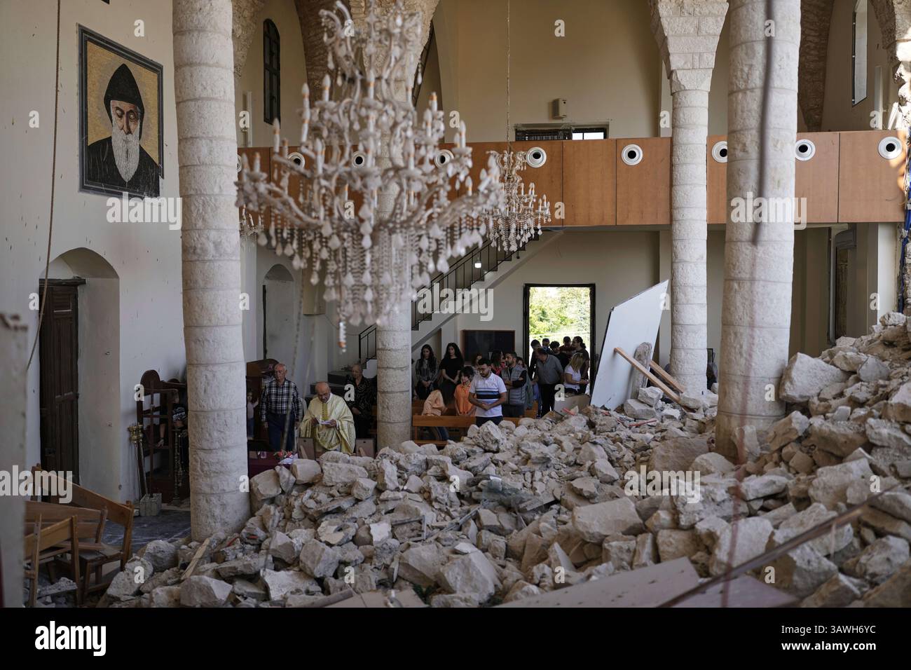 Worshippers gather for Easter Mass inside the ruins of St. George ...