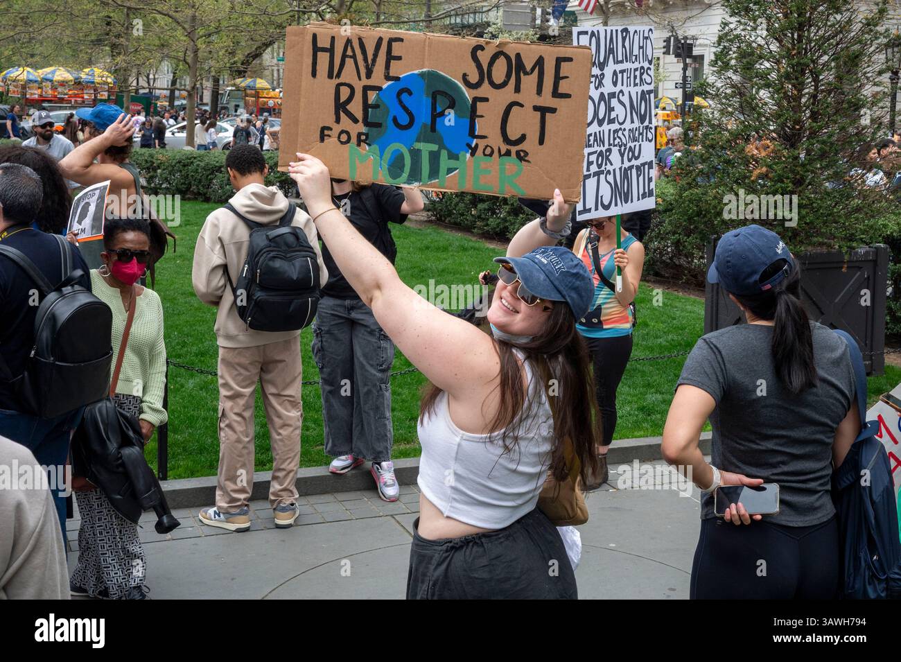 New York, United States. 19th Apr, 2025. A protester holds a "HAVE SOME ...