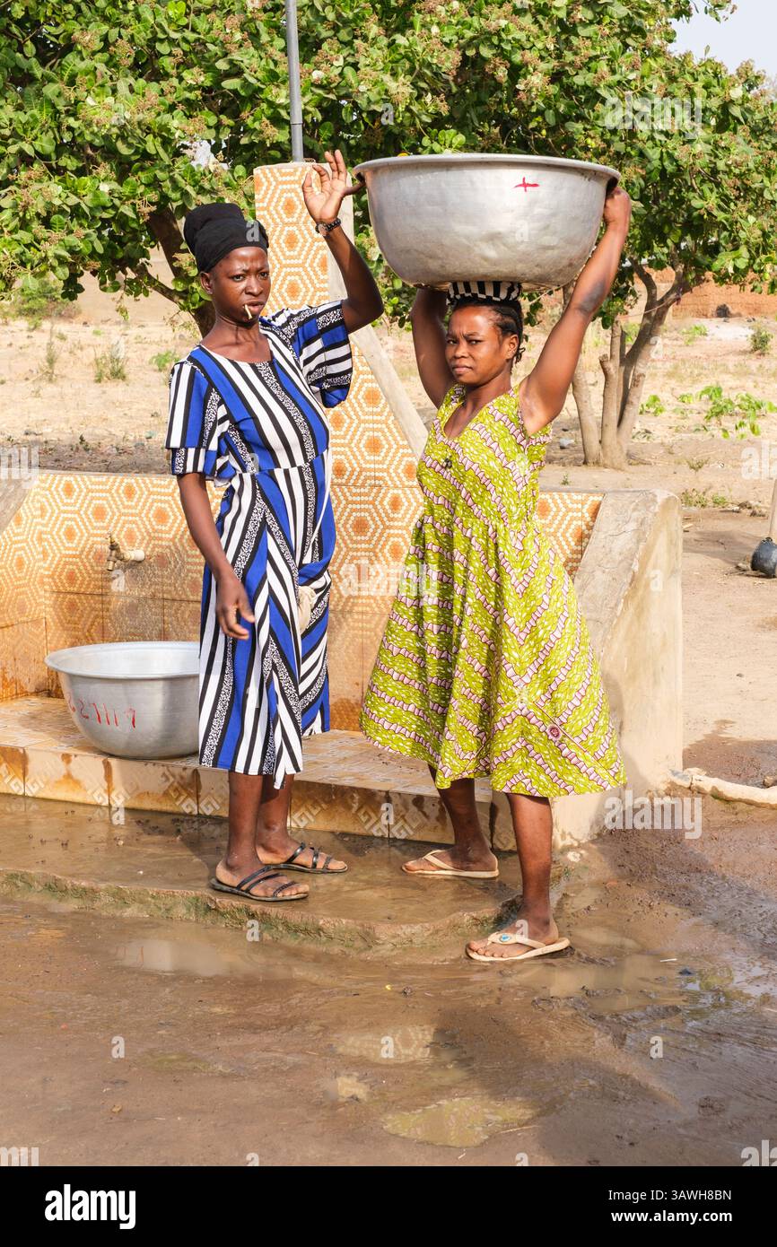 Sonyo, Ghana. Steadying the Load on Top of the Head. Lady on the left ...