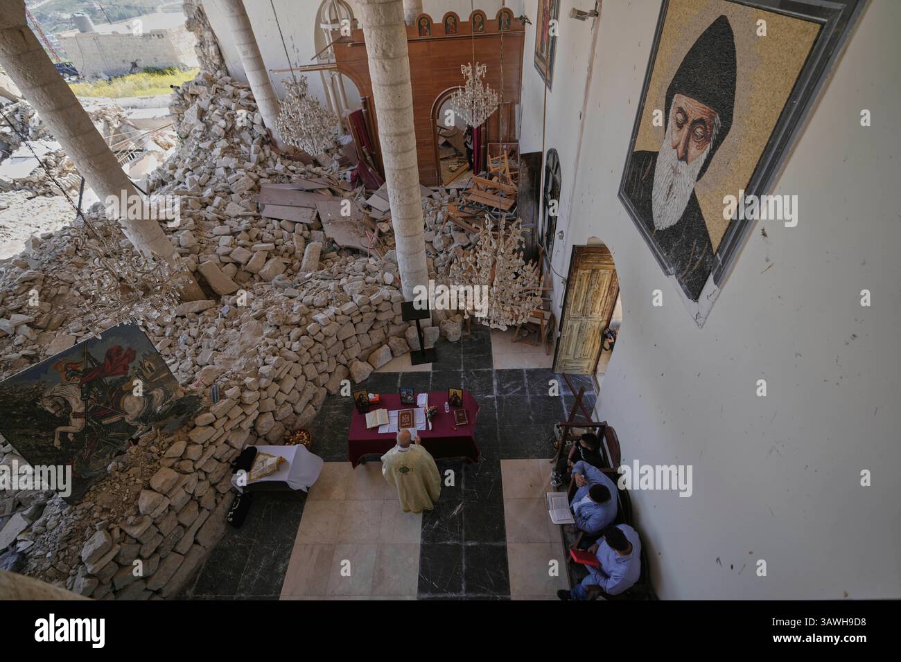 Worshippers gather for Easter Mass inside the ruins of St. George ...