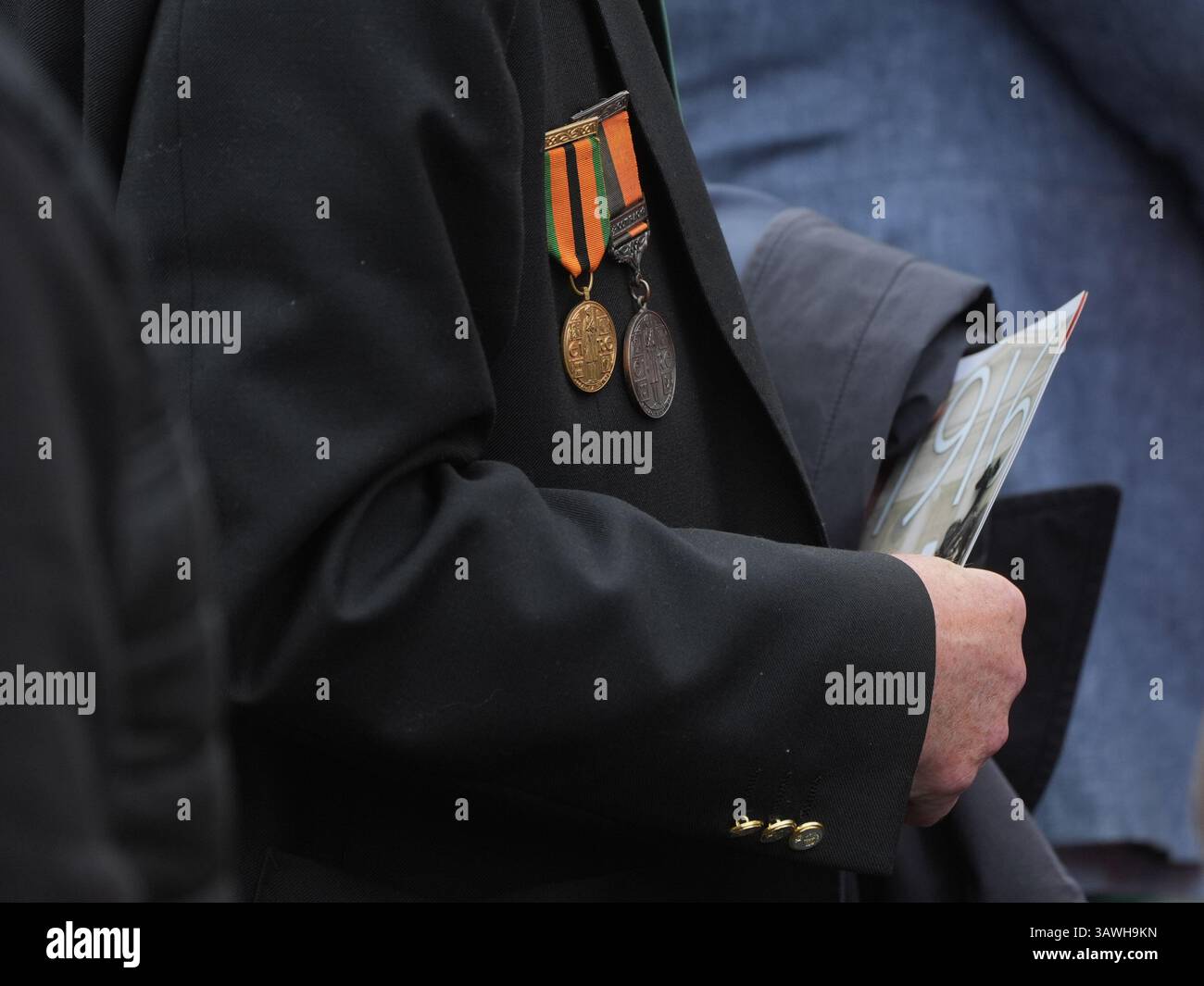 A man wearing his medals during a ceremony to mark the anniversary of ...