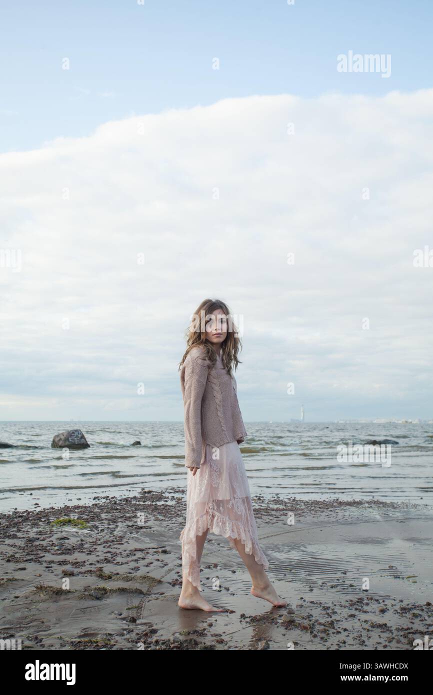 Barefoot spring woman walking outdoors on nature background, fashion ...