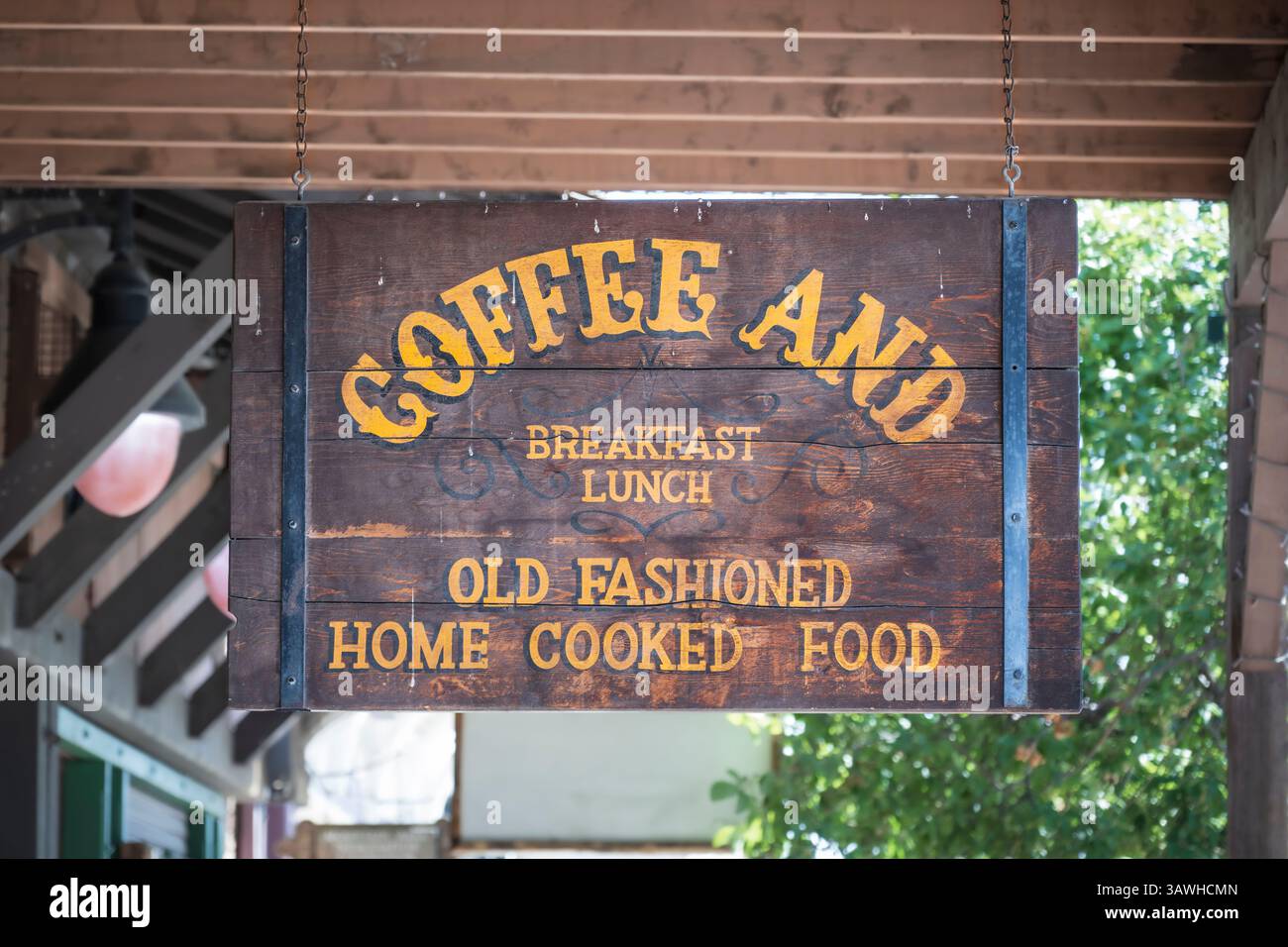 An old fashioned wooden sign, advertising coffee and food on a old time ...