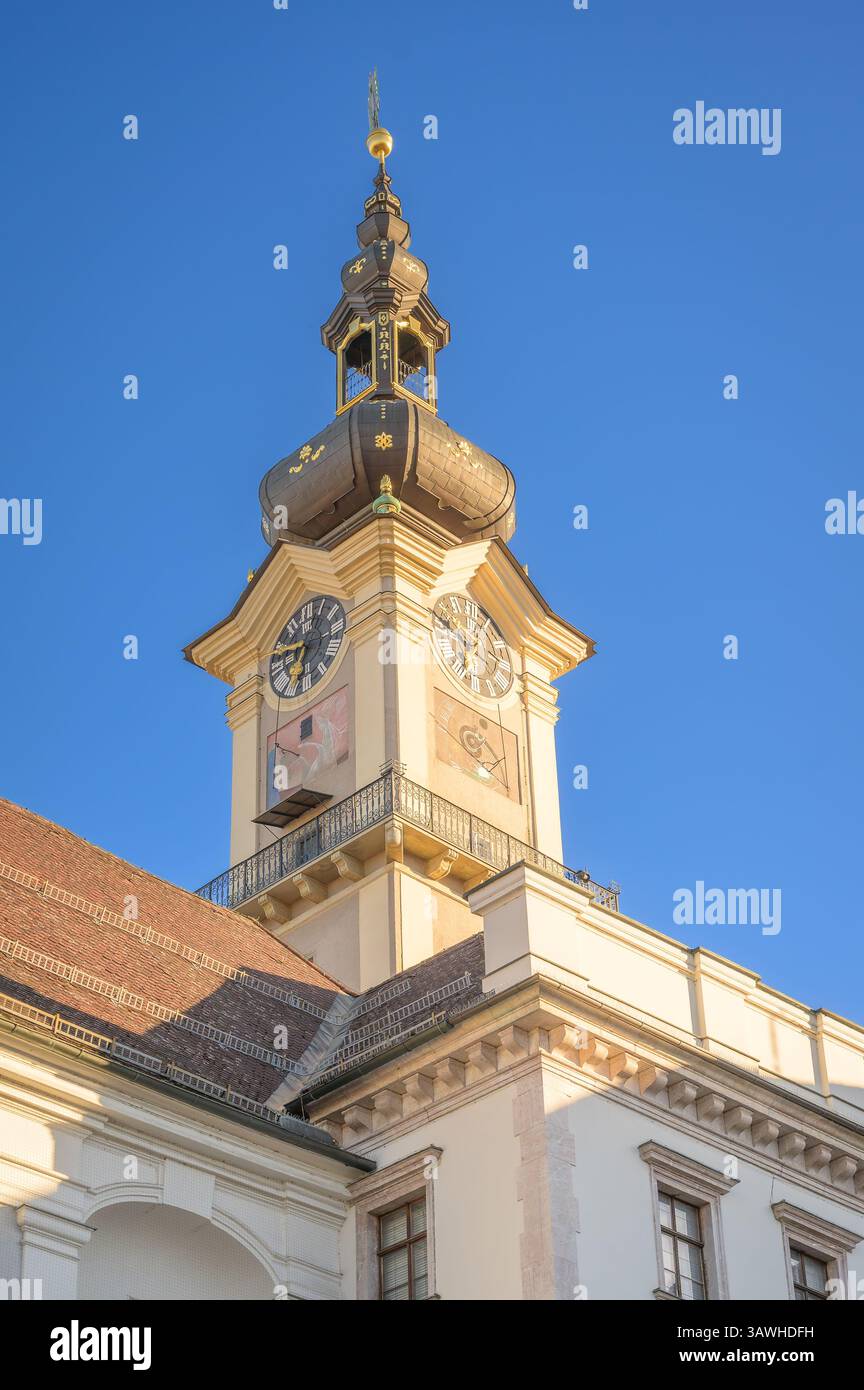 Minoritenkirche in Linz showcases its iconic tower, featuring a gold ...