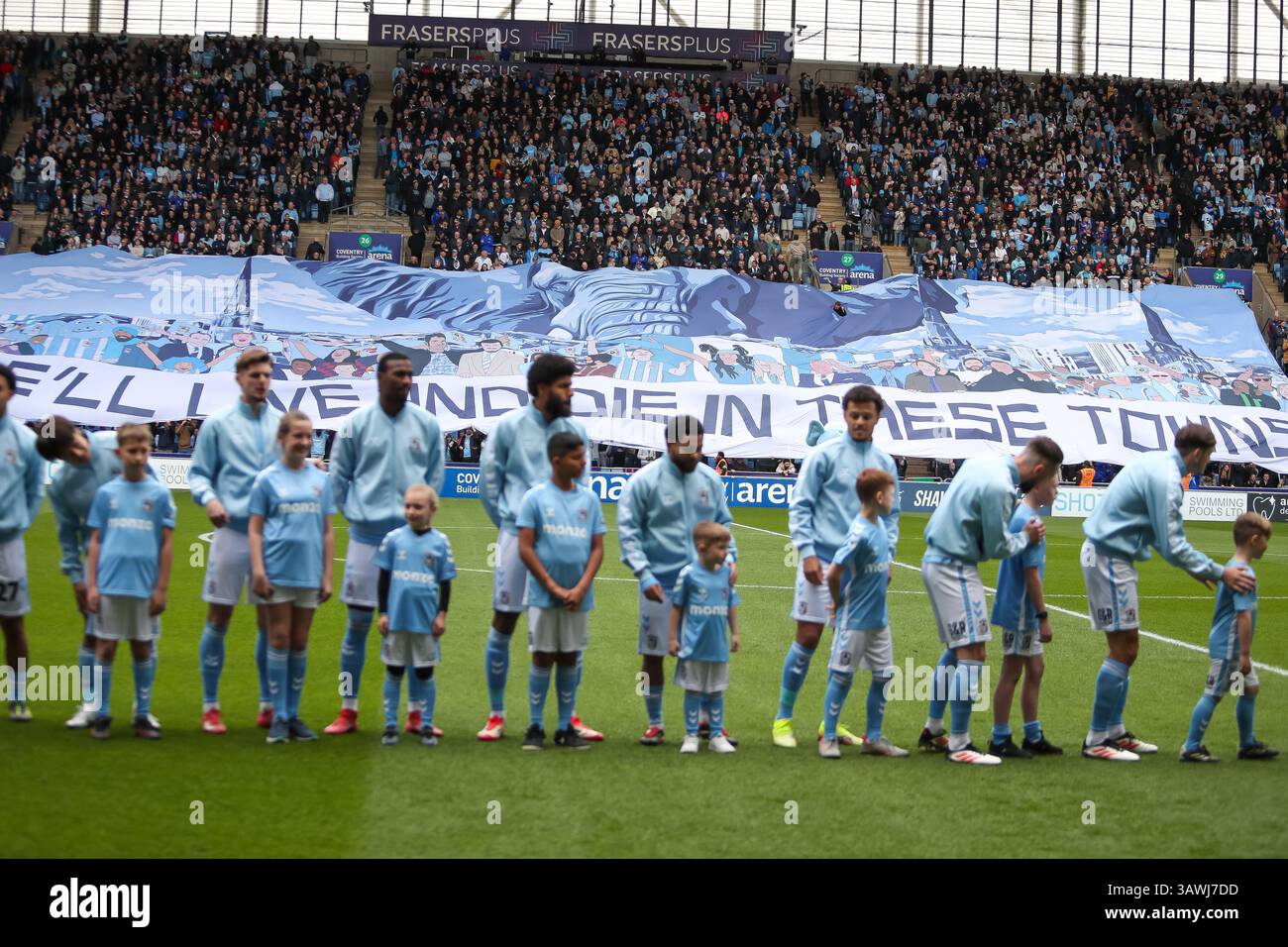 Coventry City fans hold a banner up as the players walk ou before the ...