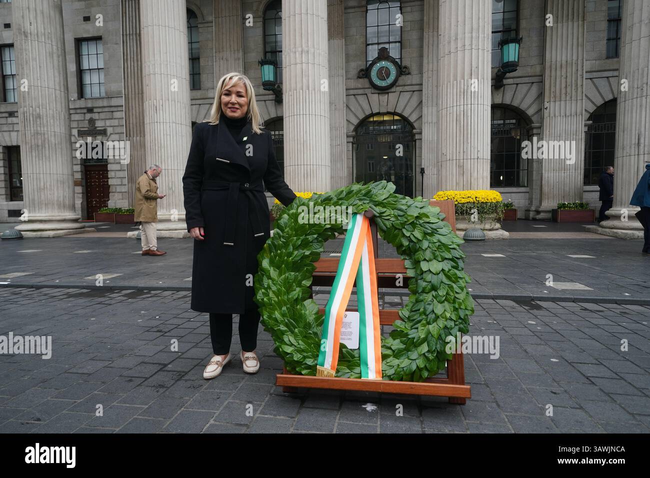 First Minister of Northern Ireland Michelle O'Neill stands next to a ...