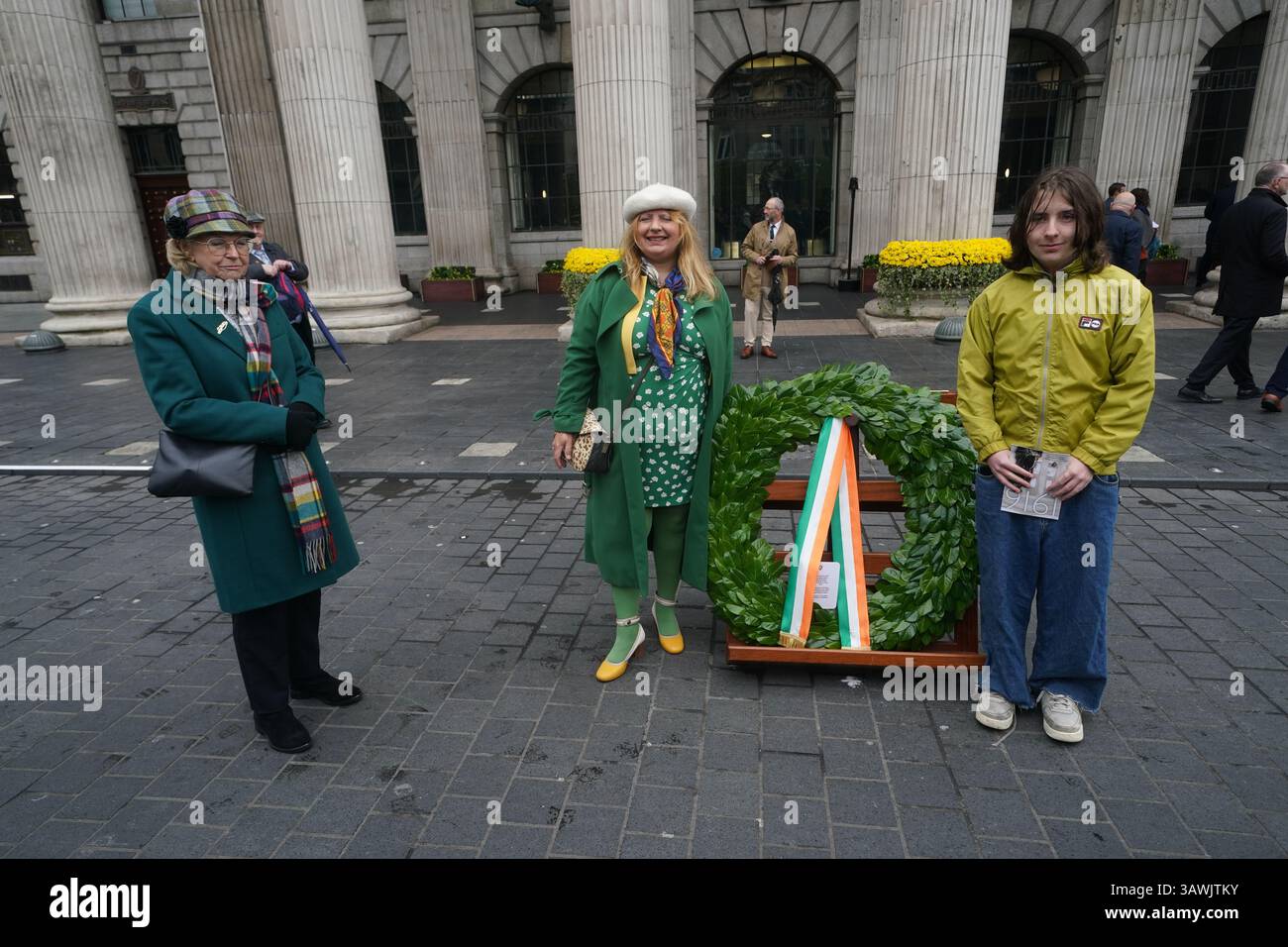 Members of the public pose for pictures next to the wreath laid during ...