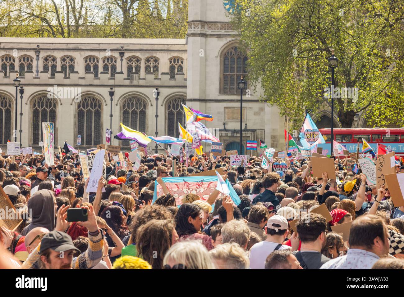 London, UK. 19 APR, 2025. Crowd hold signs and flags as thousands ...