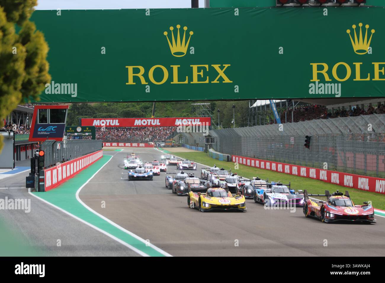 Imola, Italy. 20th Apr, 2025. A tight pack of Hypercars charge into the ...