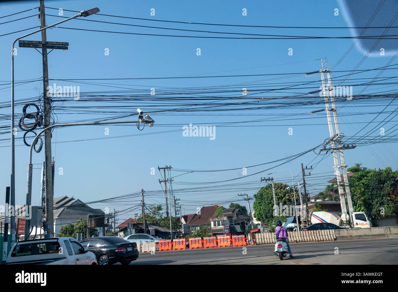 A criss-cross of heavy thick cables are a common sight on local and main roads in Chiang Mai ...