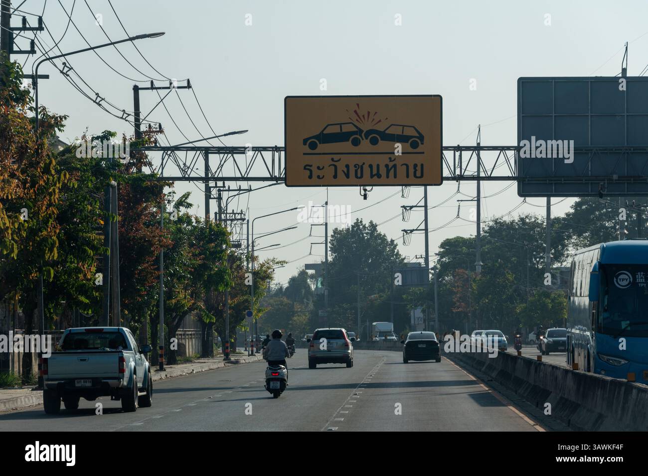 A dual carriageway with a Traffic Crash warning sign in Chiang Mai ...