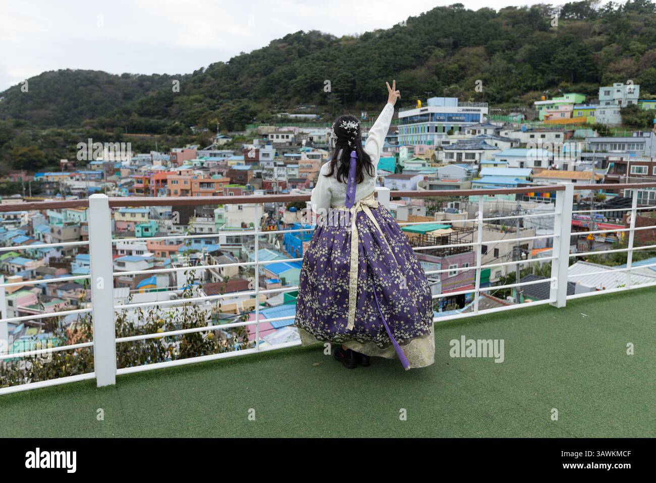 Korean woman wearing traditional dress hanbok visiting Gamcheon Culture ...