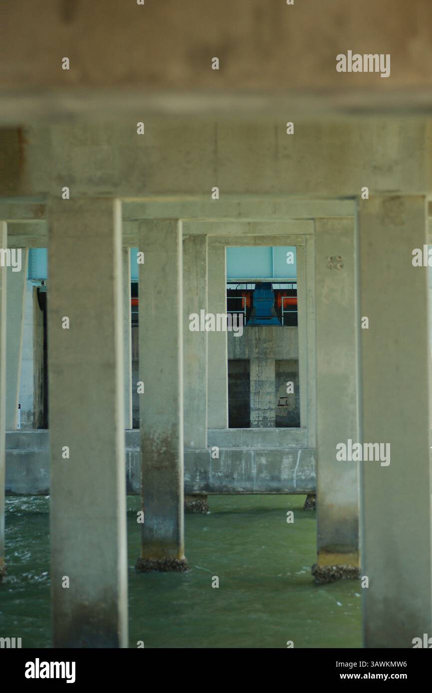 Urban Draw Bridge Support Columns Over Green Water in a Modern ...