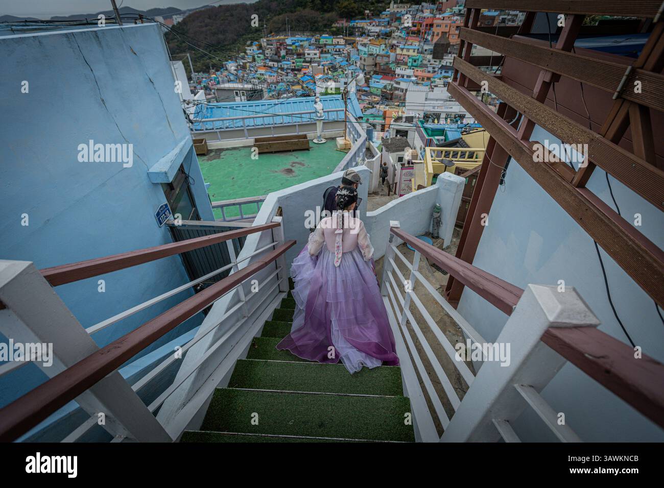 Korean woman wearing traditional dress hanbok visiting Gamcheon Culture ...