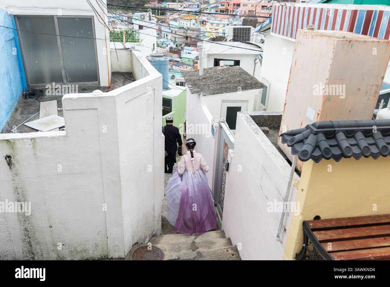 Korean woman wearing traditional dress hanbok visiting Gamcheon Culture ...
