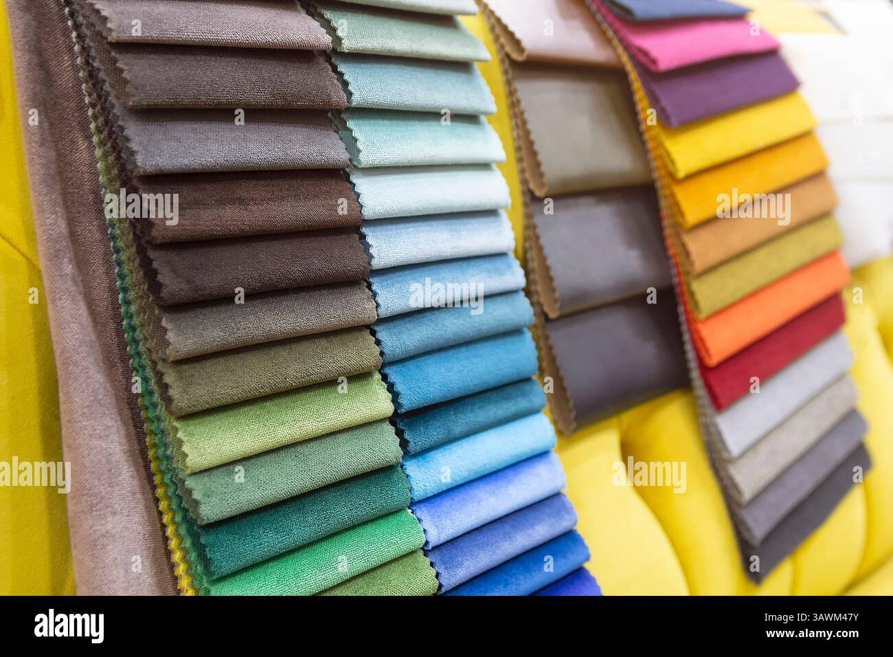 Color fabric samples of various colors in a furniture store. Industry ...